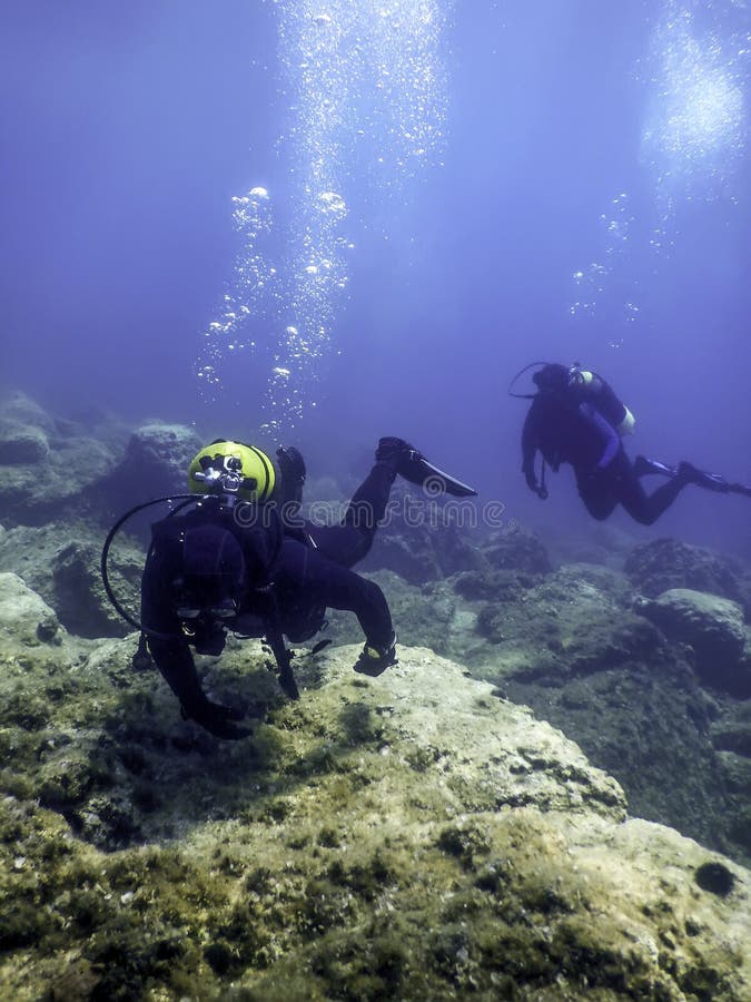 Group of Divers at the Bottom of the Sea Stock Photo - Image of group ...