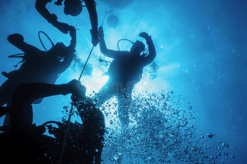 Group of Divers on Safety Stop Underwater Bubbles Stock Image - Image ...