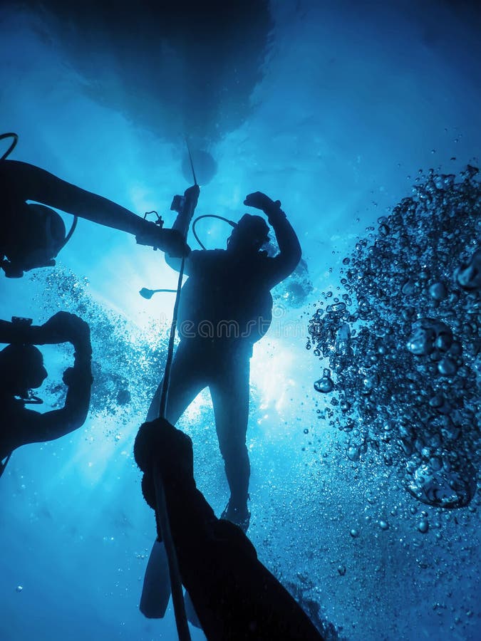Group of Divers on Safety Stop Underwater Bubbles Stock Photo - Image ...