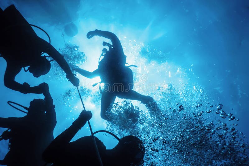 Group of Divers on Safety Stop Underwater Bubbles Stock Image - Image ...