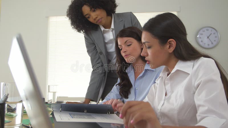 Group of Diverse Business Women Working Together at Laptop Computer ...