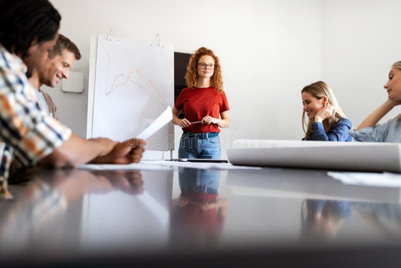 Group of Diverse Designers, Business People Brainstorming on Meeting in ... Group of Diverse Designers, Business People Brainstorming on Meeting in ...
