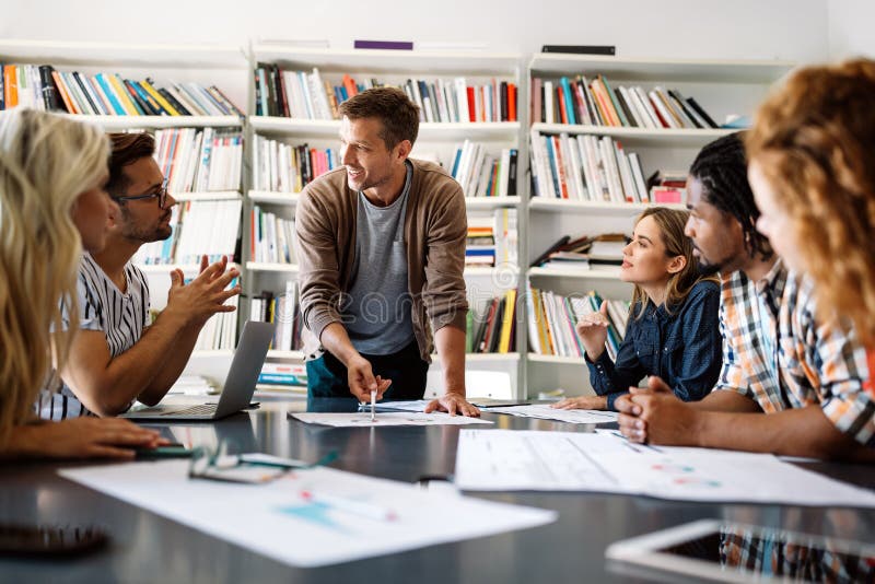 Group of Diverse Designers, Business People Brainstorming on Meeting in ... Group of Diverse Designers, Business People Brainstorming on Meeting in ...
