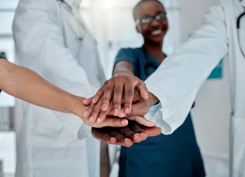 Group of Diverse Doctors Stacking Their Hands Together in Support while ...
