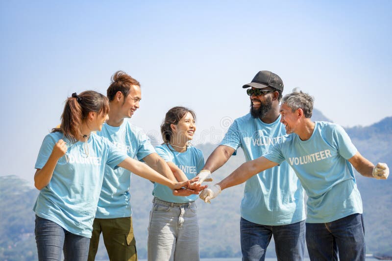 Group of Diverse Ethnicity Volunteers Smiling,stacked Hands Together Gesture of Engage in Some ...