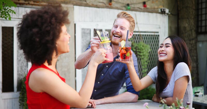 Group of Diverse Friends Talking and Having Fun at Cafe Outdoor Stock ...