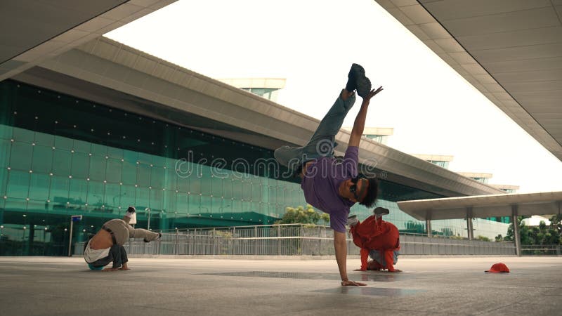 Group of Diverse Hipster or Dancer Doing Head Spin in Front of Mall ...