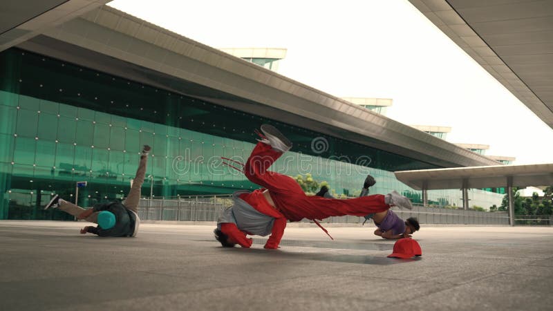 Group of Diverse Hipster or Dancer Doing Head Spin in Front of Mall ...