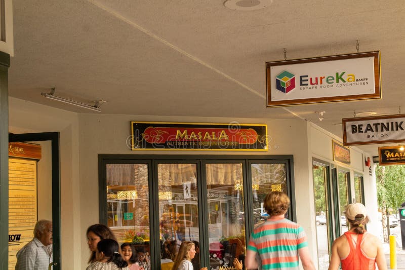 People Stand Outside a Store with Many Windows on Each Side Editorial ...