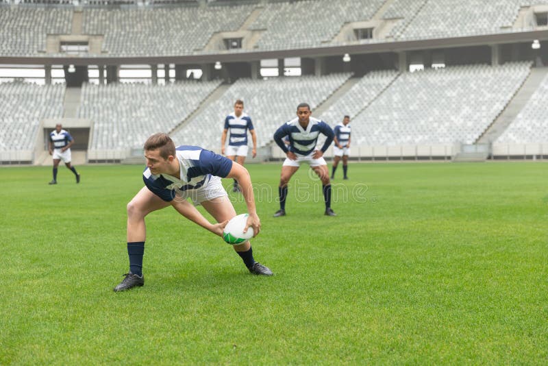 Group of Diverse Male Rugby Players Playing Rugby Match in Stadium ...
