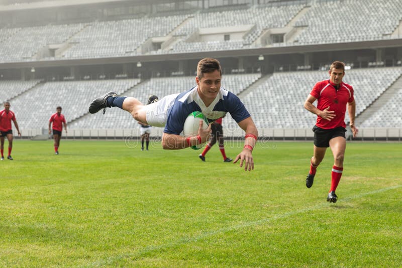 Group of Diverse Male Rugby Players Playing Rugby in Stadium Stock ...