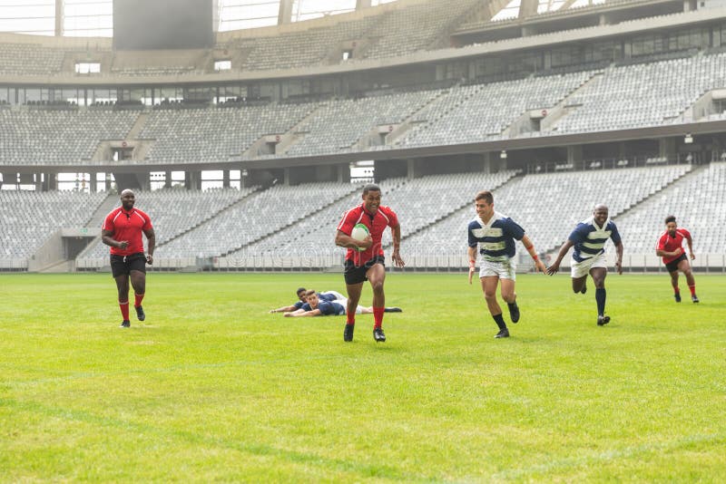 Group of Diverse Male Rugby Players Playing Rugby in Stadium Stock ...