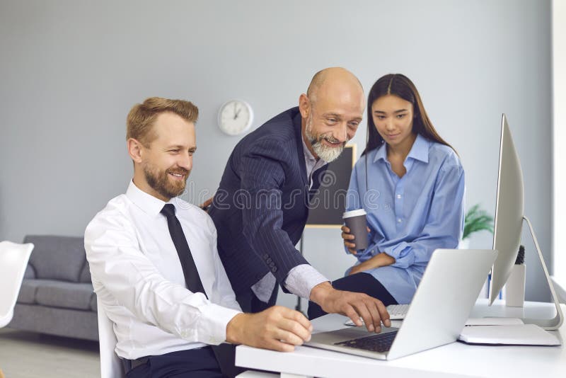 Happy Office Workers Using Laptop To Work on Project or To Watch Funny ...