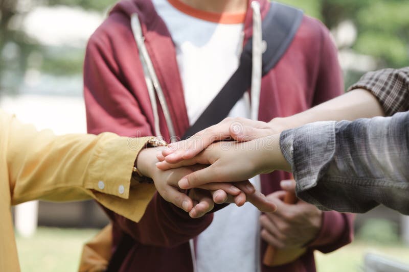 A Group of Diverse, Multiracial Young People are Shown Happily Stacking ...