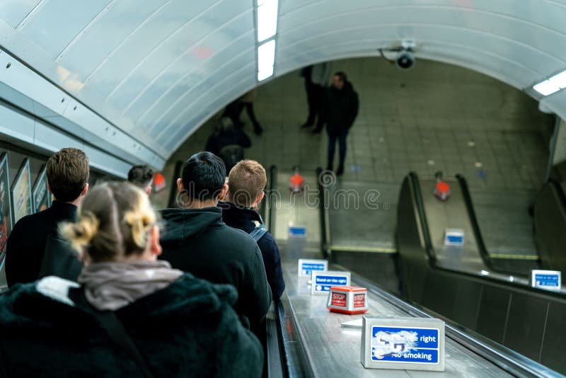 People are Moving Down the Escalator in a Building Editorial Stock ...