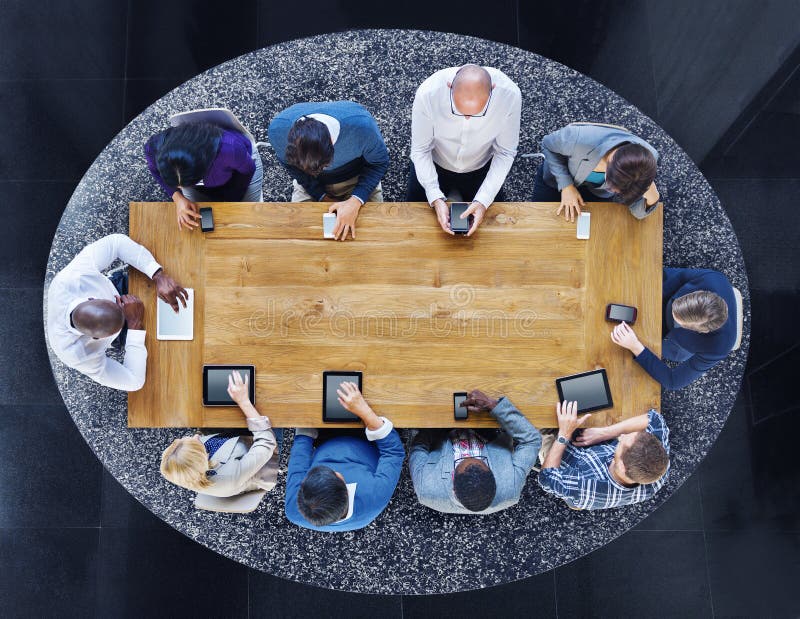 Group of Diverse People in a Table Using Devices Stock Photo - Image of ...