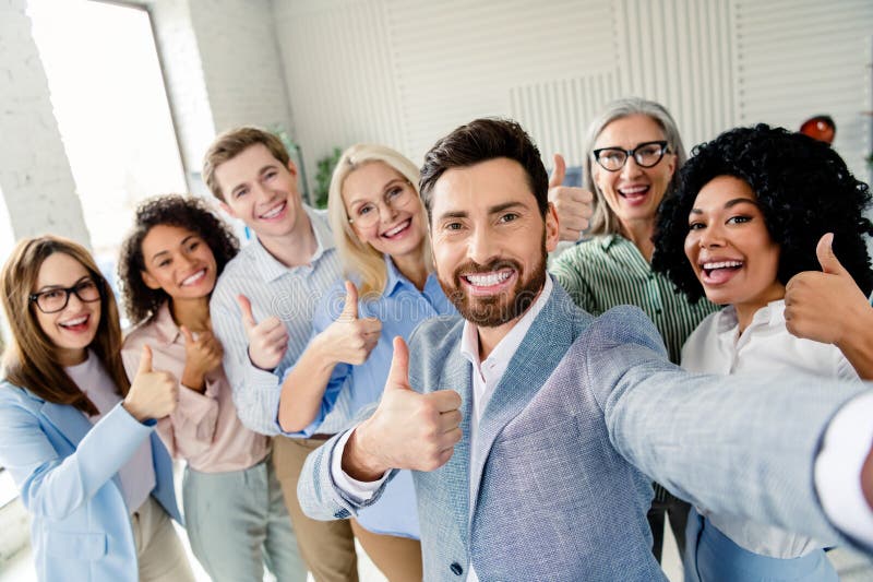 Group of Diverse Professionals Expressing Positivity and Teamwork in a ...