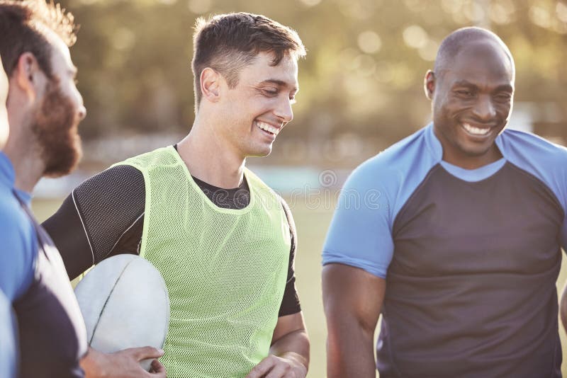 Group of Diverse Rugby Players Standing in a Huddle during Training ...