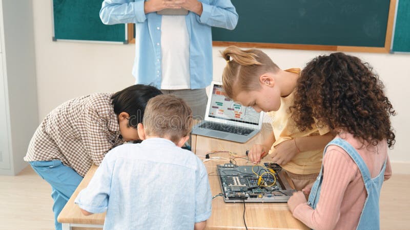 Group of Diverse Student Working Together while Teacher Hold Tablet ...