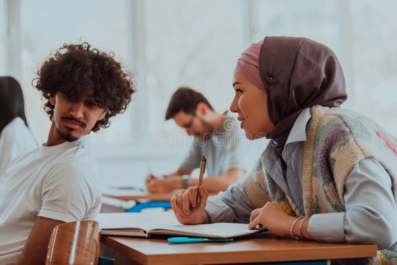 A Group of Diverse Students Engages in Lively Discussion As they ...