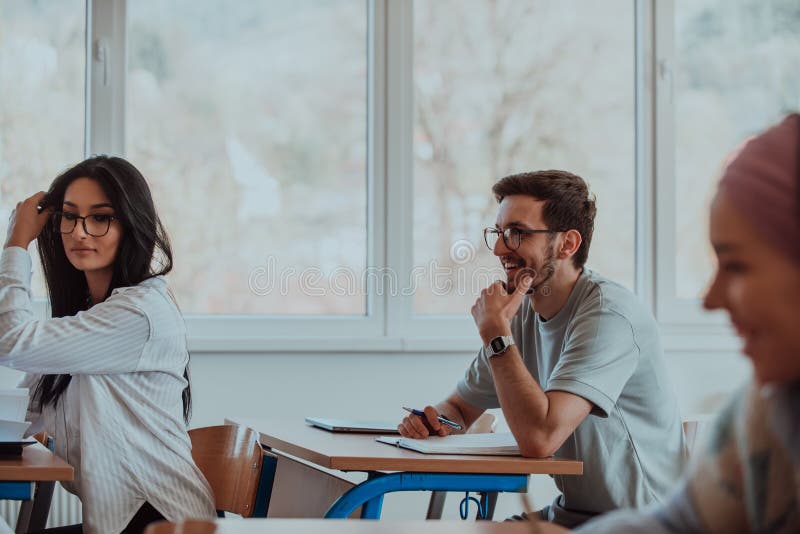 A Group of Diverse Students Engages in Lively Discussion As they ...