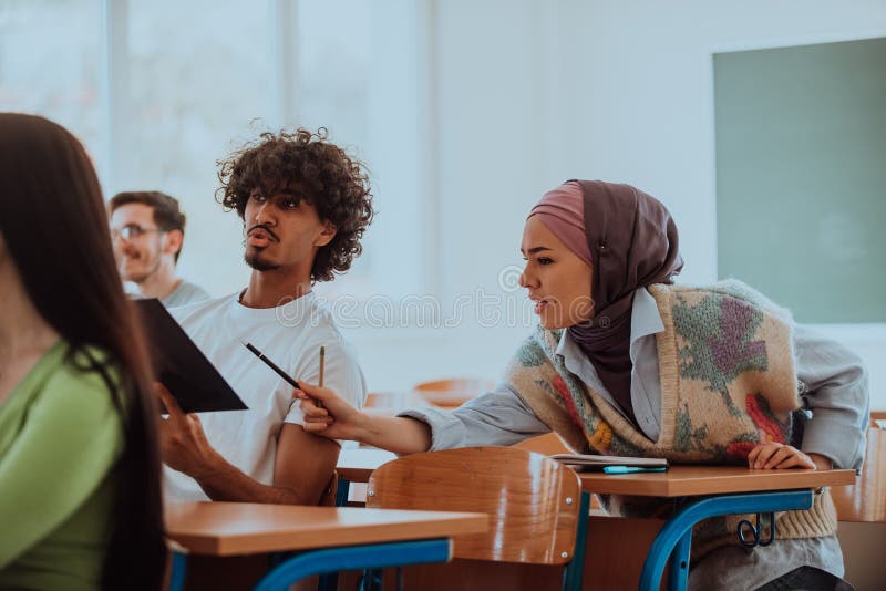 A Group of Diverse Students Engages in Lively Discussion As they ...