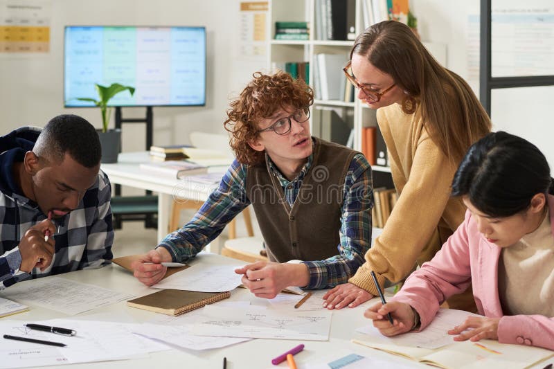 Studying Foreign Languages Around Classroom Table Stock Photos - Free ...