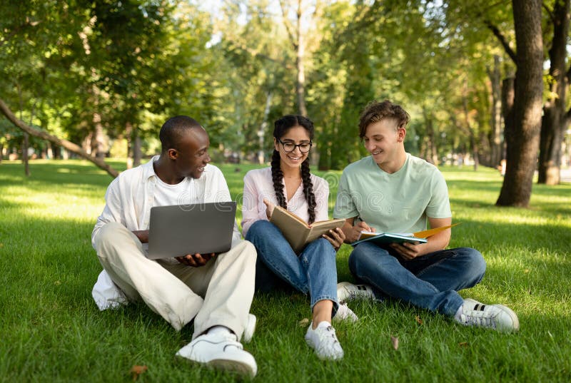 Group of Diverse Students Friends Learning, Reading Books, Using Laptop ...