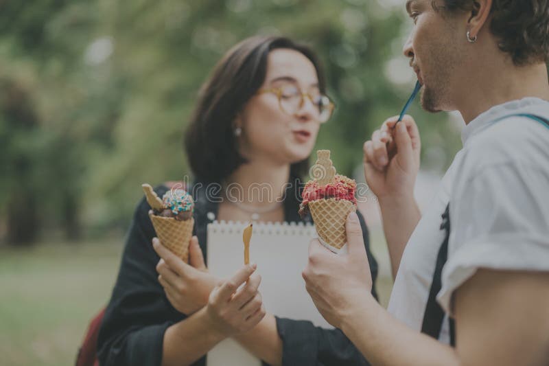 Multicultural Students Enjoying Ice Cream during a Break in the Park ...