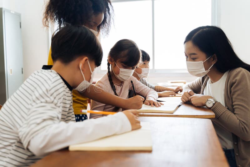 Group of Diverse Students in School Building Discussing in Group Study ...