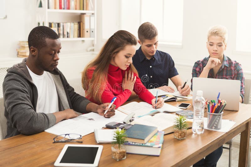 Group of Diverse Students Studying at Wooden Table Stock Image - Image ...