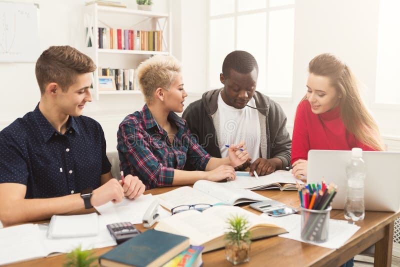 Group of Diverse Students Studying at Wooden Table Stock Photo - Image ...