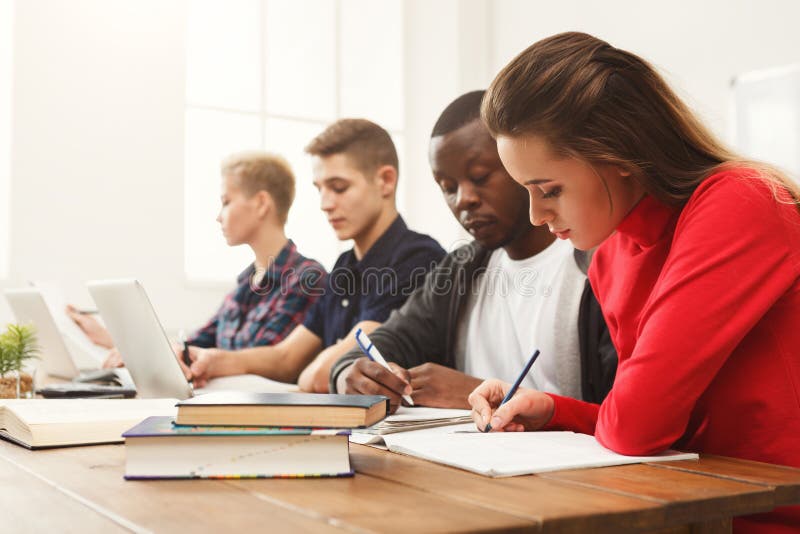 Group of Diverse Students Studying at Wooden Table Stock Image - Image ...