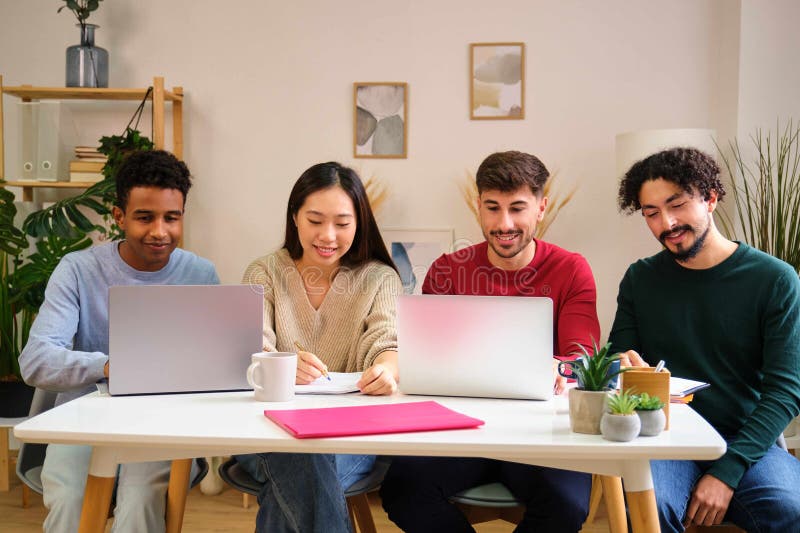 Group of Diverse University Colleagues Studying Together at Shared Flat ...