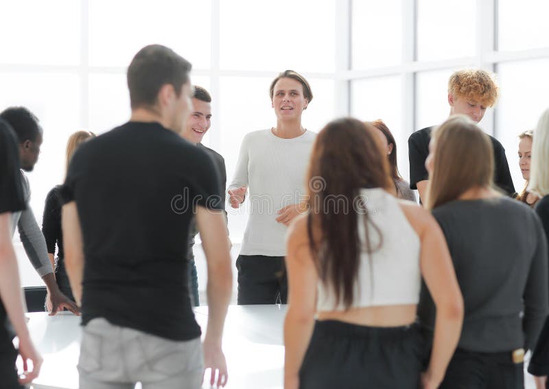 Group of Diverse Young People Standing Around a Round Table Stock Image ...
