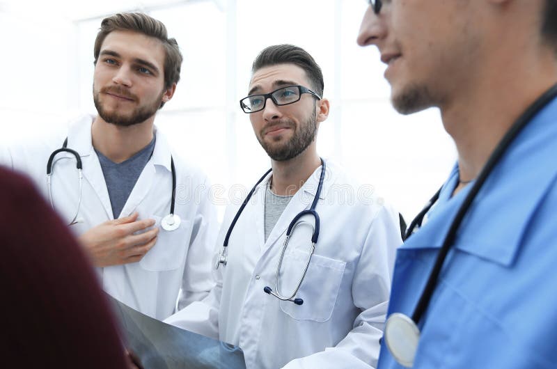 Group of Doctors Advising the Patient Stock Photo - Image of clinic ...