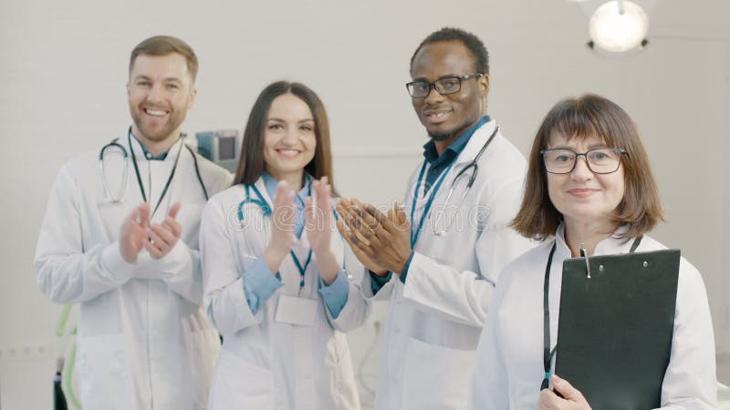 Group of Doctors Applause Together at Medical Clinic Stock Footage ...