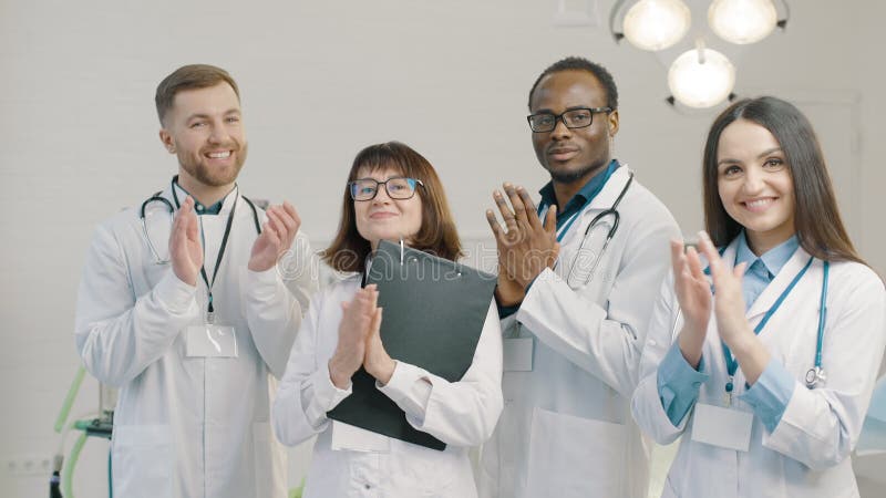 Group of Doctors Applause Together at Medical Clinic Stock Footage ...