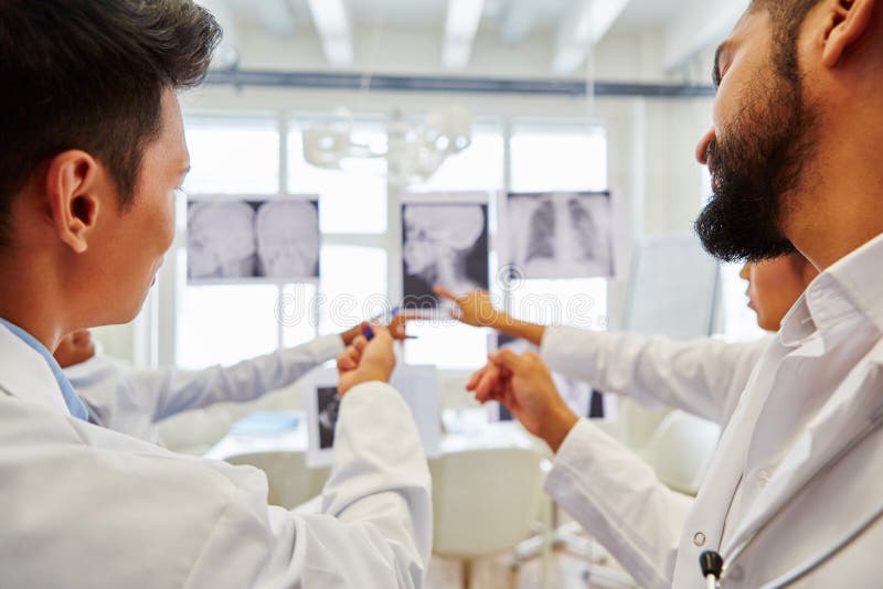 Group of Radiologists Analyzing X-ray Image Stock Image - Image of ...