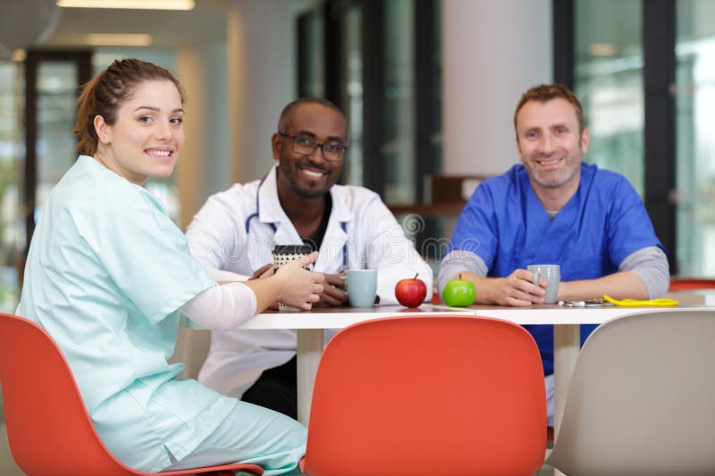Group Doctors in Cafeteria Eating and Relaxing Stock Photo - Image of ...