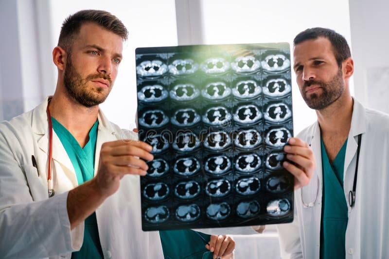 Group of Doctors Checking X-rays in a Hospital. Stock Image - Image of ...
