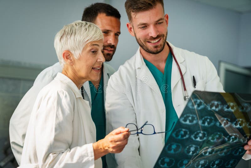Group of Doctors Checking X-rays in a Hospital. Stock Photo - Image of ...
