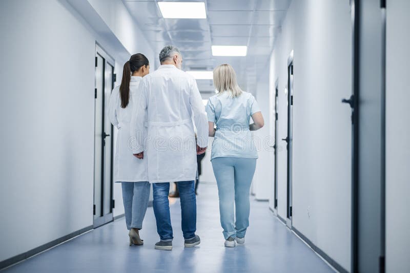 Group of Doctors in the Clinic Corridor Stock Photo - Image of indoors ...