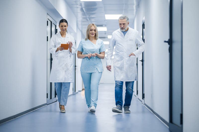 Group of Doctors in the Clinic Corridor Stock Image - Image of work ...