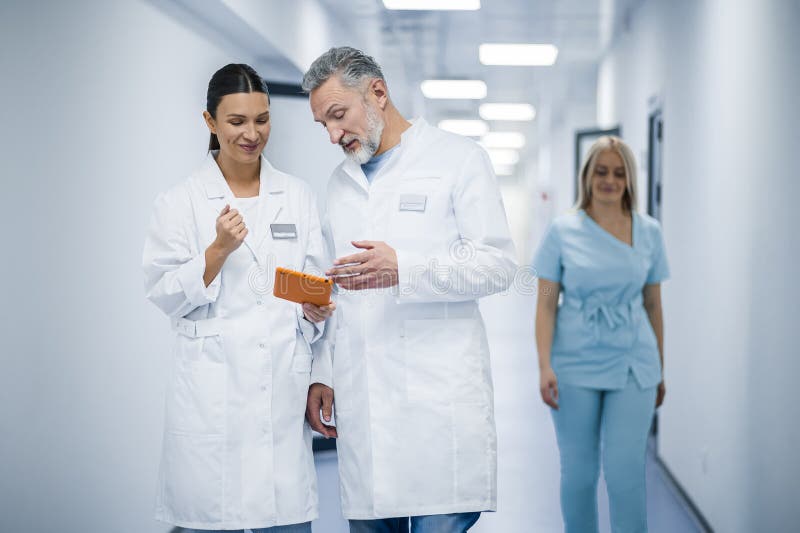 Group of Doctors in the Clinic Corridor Stock Photo - Image of ...