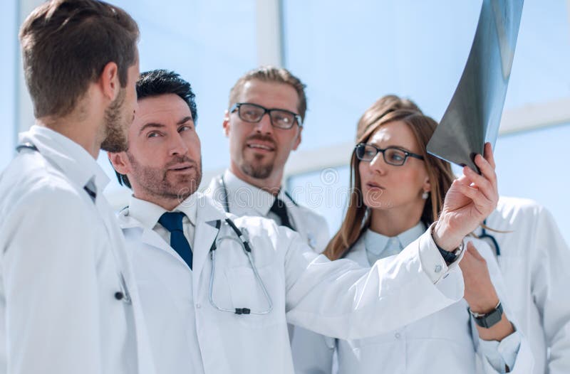 Group of Doctors Discussing the X-ray Stock Photo - Image of healthcare ...