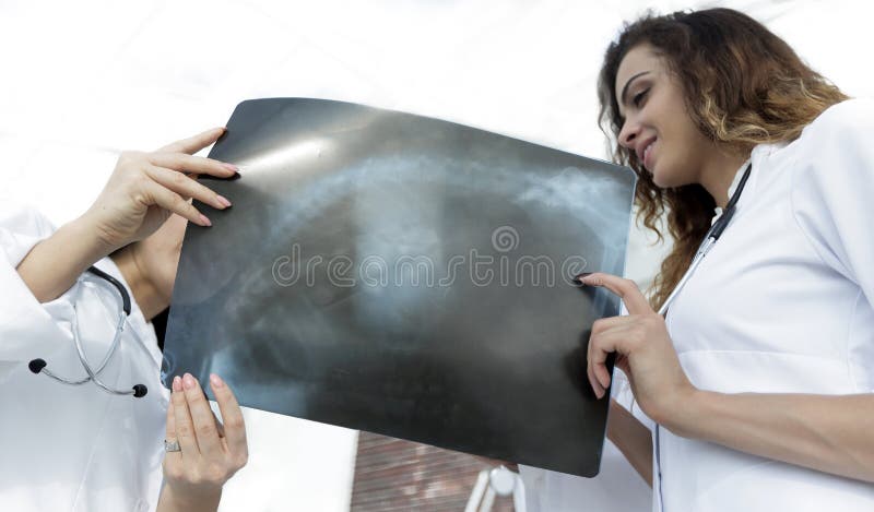 Group of Doctors Discussing an X-ray. Stock Image - Image of consult ...