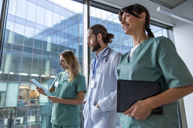Group of Doctors Discussing Something and Looking Excited and ...