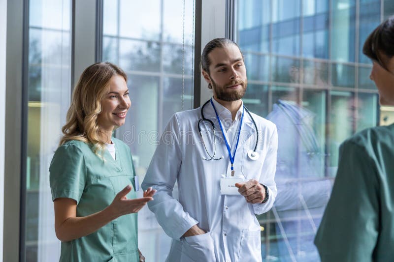 Group of Doctors Discussing Something and Looking Excited and ...