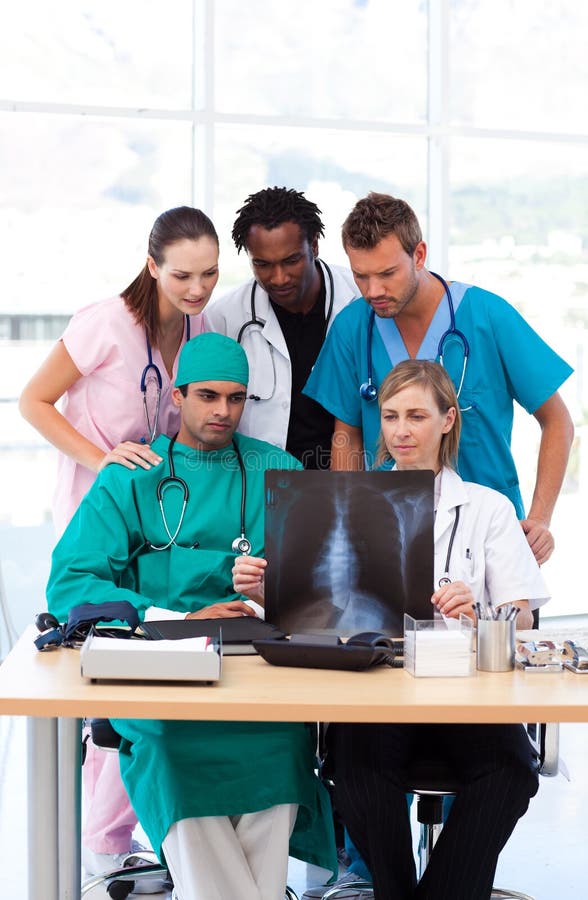 Group of Doctors Examining an X-ray Stock Photo - Image of nurse ...